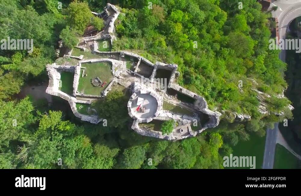 REVERSE OVERHEAD TILT SHOT OF ANCIENT CASTLE RUINS IN SWITZERLAND Stock ...