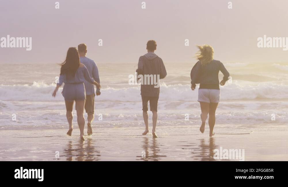 Running into surf Stock Videos & Footage - HD and 4K Video Clips - Alamy