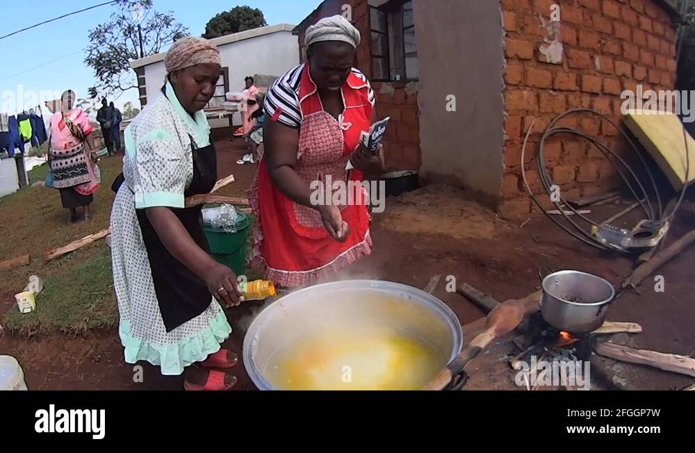 Rural women cooking traditional food for a ceremony Stock Video Footage ...