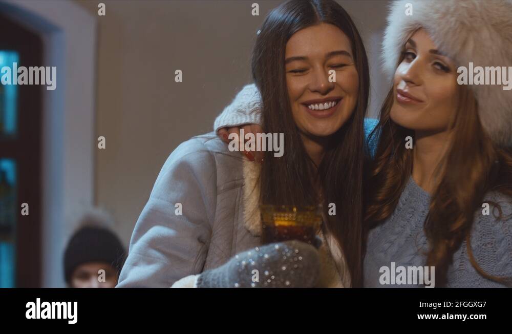 Two cheerful girls hugging, one girl kissing her best female friend on ...