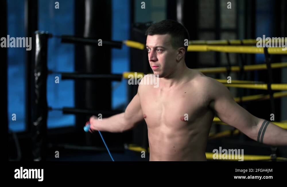 Boxer jumping rope boxing ring behind HD slow motion video. Sport ...