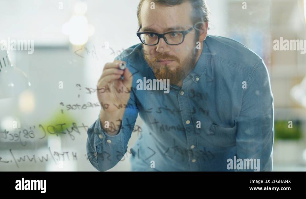 Close-up of a Man Writing Formulas on a Glass Whiteboard Stock Video ...
