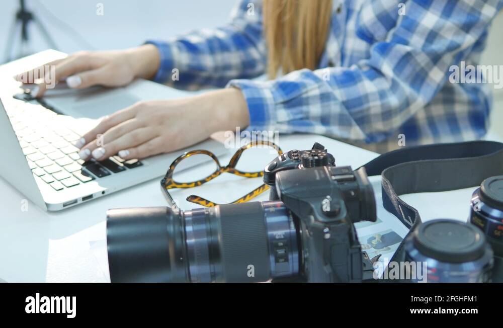 Female photographer working in her studio hands close up and digital ...