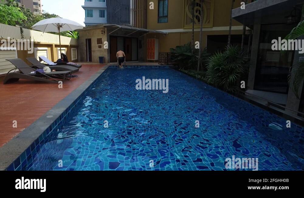 Man getting into pool Stock Videos & Footage - HD and 4K Video Clips ...