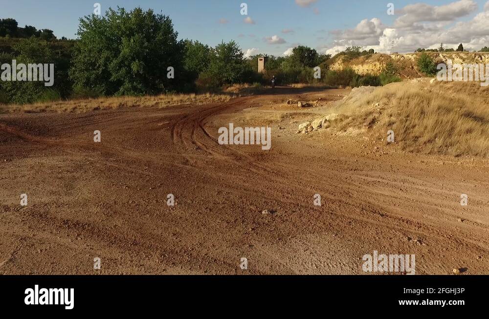 Motocross in a field, the motion curve in front of the camera. About ...