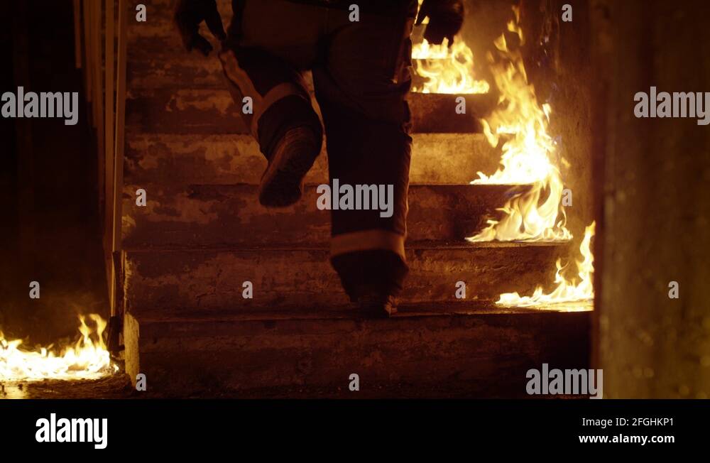 Close-up of a Firefighter's Legs Running Up the Burning Stairs Stock ...