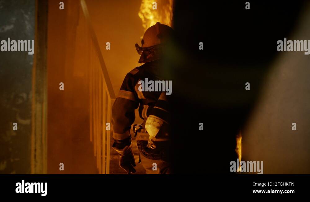 Two Brave Firefighters Enter Into Open Doors and Run Up The Burning ...