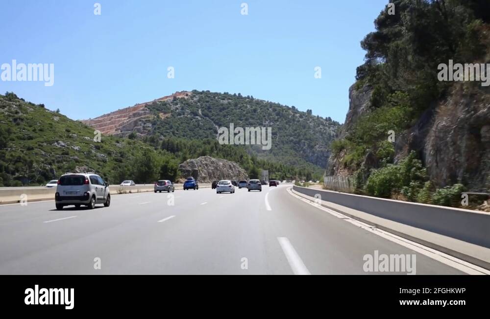 Movement on the wide multi-lane road in the mountains in France Stock ...