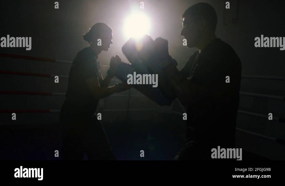 Male and Female Boxer train together in the Boxing Ring building up to ...