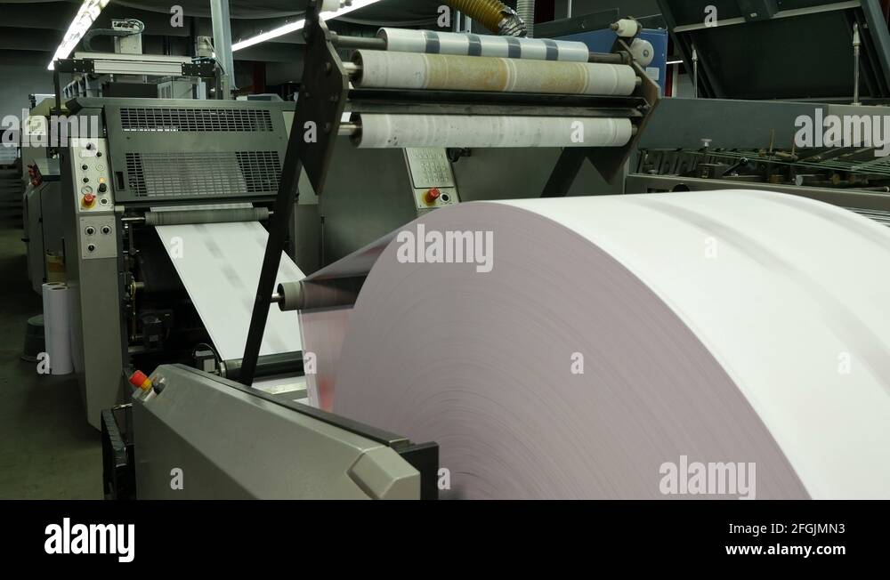 Big paper roll in an Envelope printing factory on the conveyor belt ...