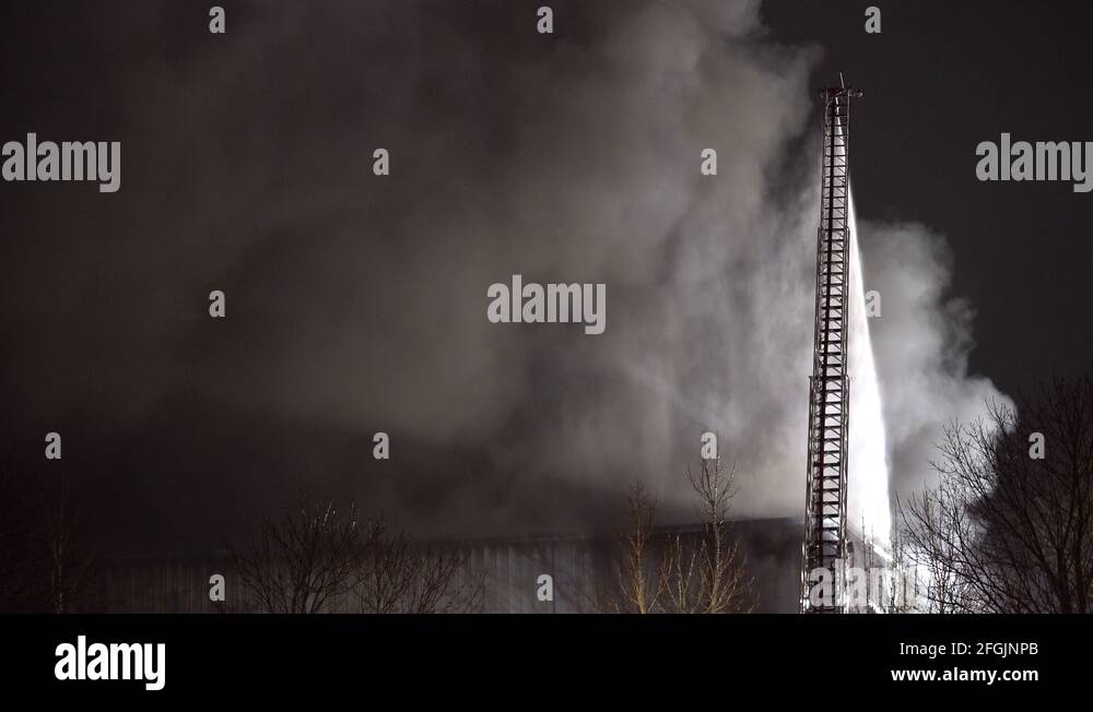 thick smoke billows from commercial structure fire Stock Video Footage ...