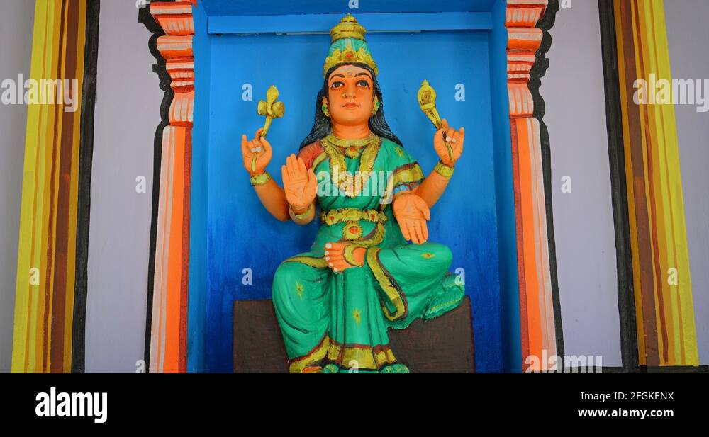Statue of a Hindu deity with Four Arms at a temple in Lankawi Stock ...