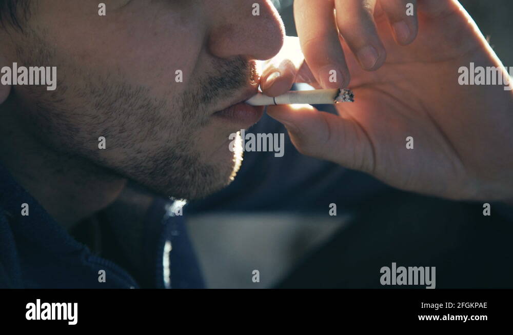 Lonely junkie smoking cigarette in catacombs 4K Stock Video Footage - Alamy