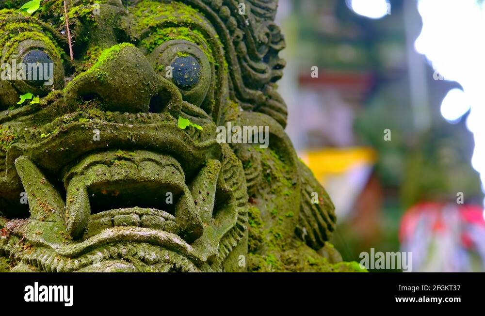 Barong Lion Guard's statue covered with moss. Balinese mythological ...