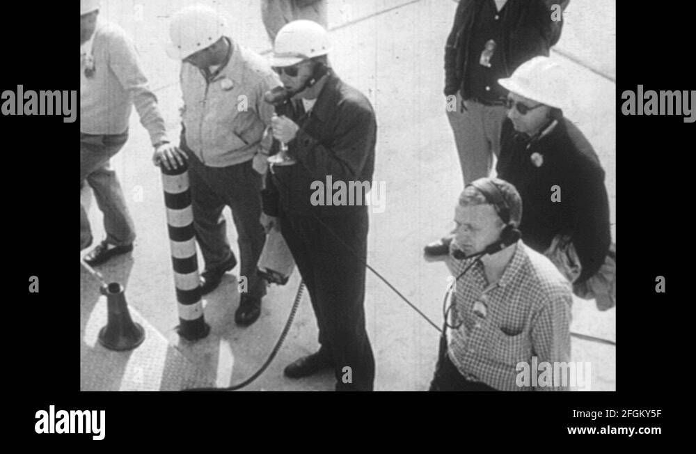 1950s: Reporters and newsmen arrive at a US base to witness the ...