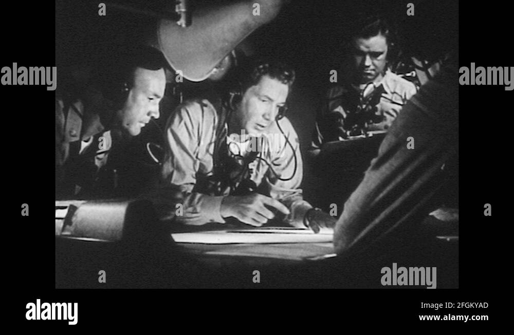 1940s: Radar operators with map / Hand marks on map / Operators, man ...