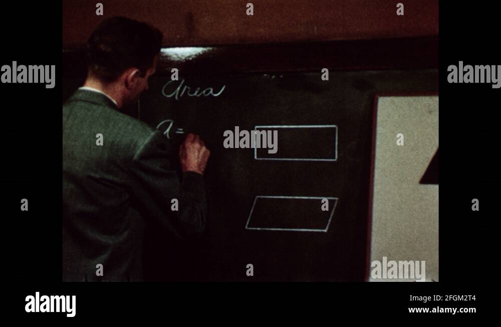 1950s: Teacher writes equation, moves piece on felt board Stock Video ...