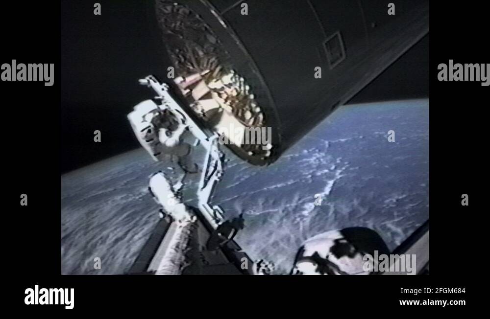1990s: Robotic arm controllers maneuver astronaut, on STS-49 mission ...