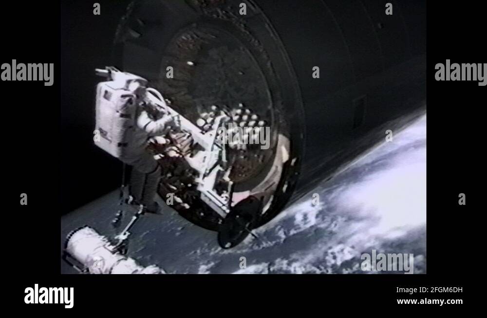 1990s: Robotic arm controllers maneuver astronaut, on STS-49 mission ...