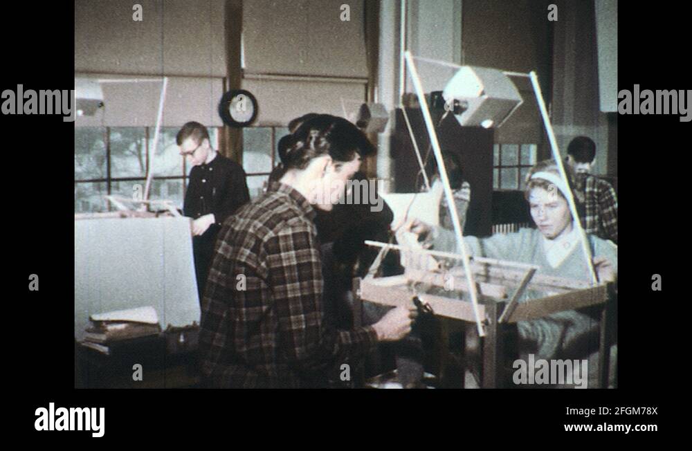 1960s: Students in classroom with lab equipment / View of light through ...