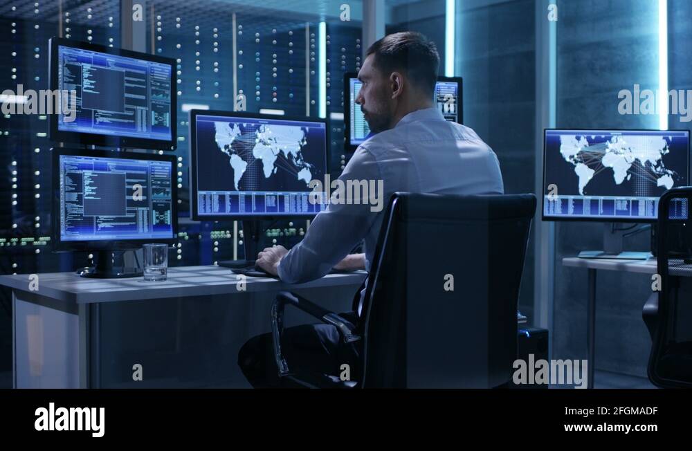 Technical Controller Working at His Workstation with Multiple Displays ...