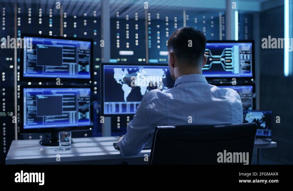 Technical Controller Working at His Workstation with Multiple Displays ...