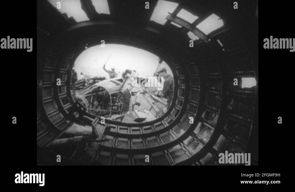 1940s: remains of crashed plane interior. Plane work on crash site ...