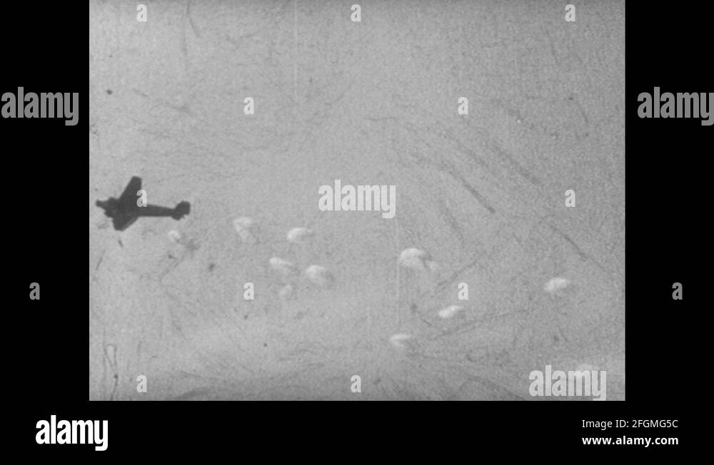 EUROPE, 1930s: German planes fly off as paratroopers jump. Paratroopers ...