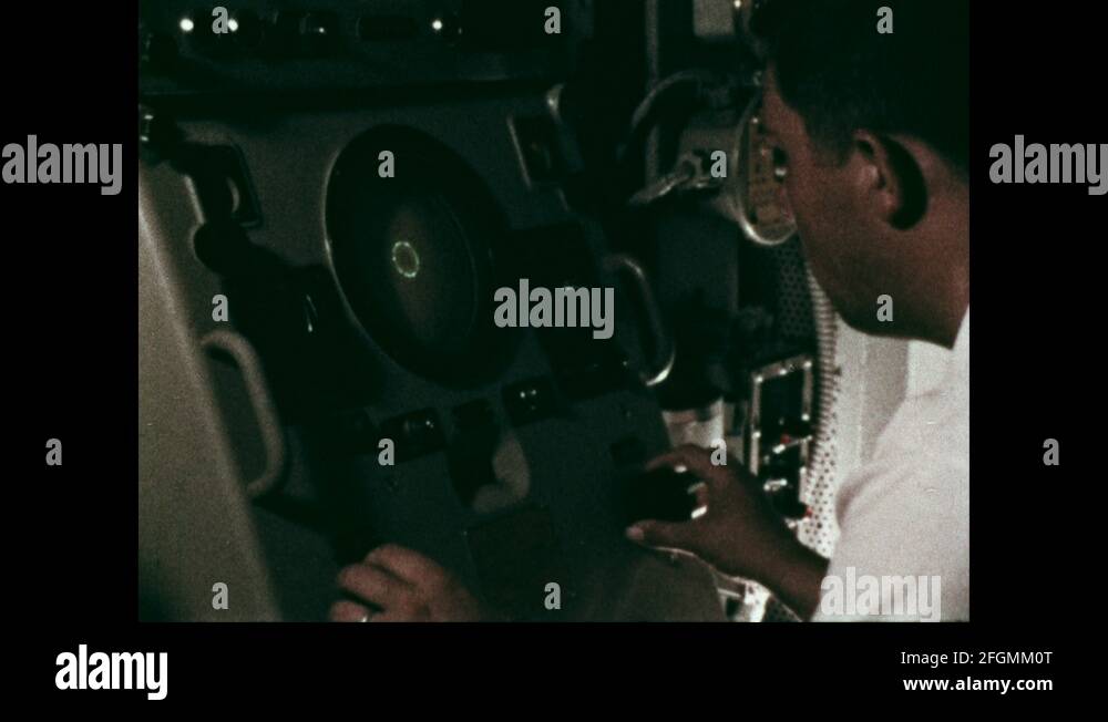 UNITED STATES: 1968: sailor watches radar monitor on ship. Sailors ...