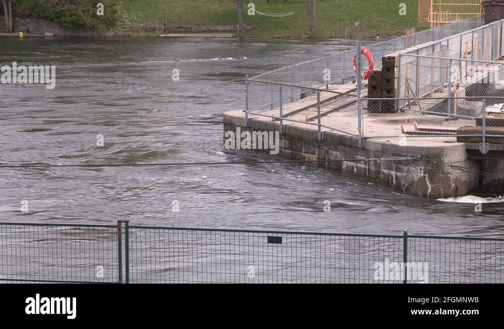 Crumbling dam and spillway infrastructure and fast flooding flood water ...