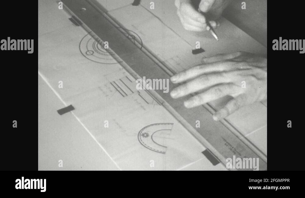UNITED STATES: 1960s: hand moves ruler on page. Hand makes line marks ...