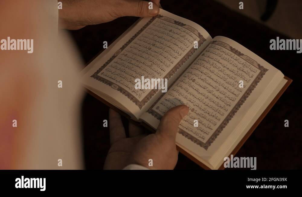 Reading the Koran, Quran, the arabic holy book. Wide Stock Video ...
