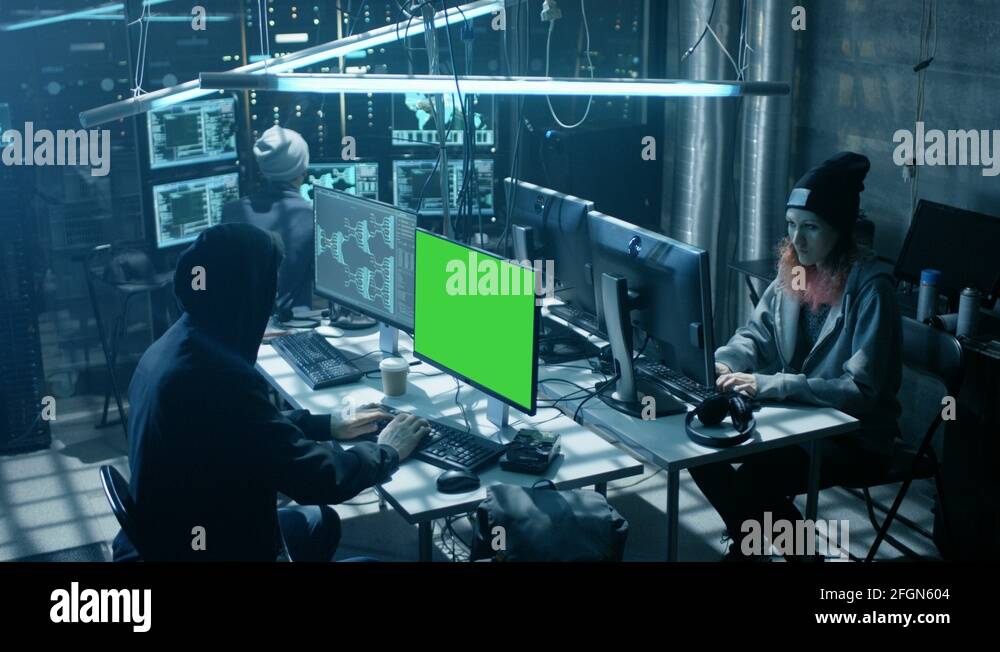 Team of Internationally Wanted Teenage Hackers with Green Screen Mock ...