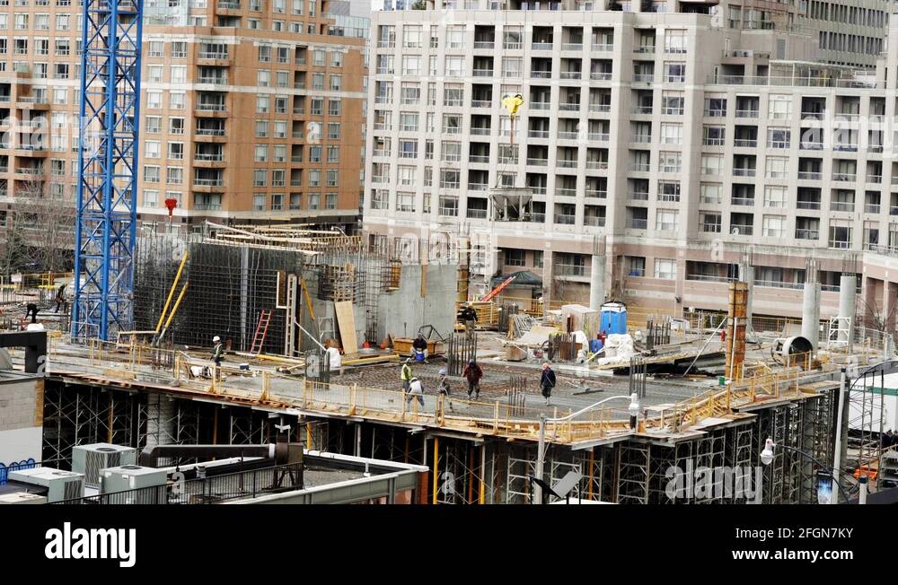construction worker building a tower in downtown toronto Stock Video ...