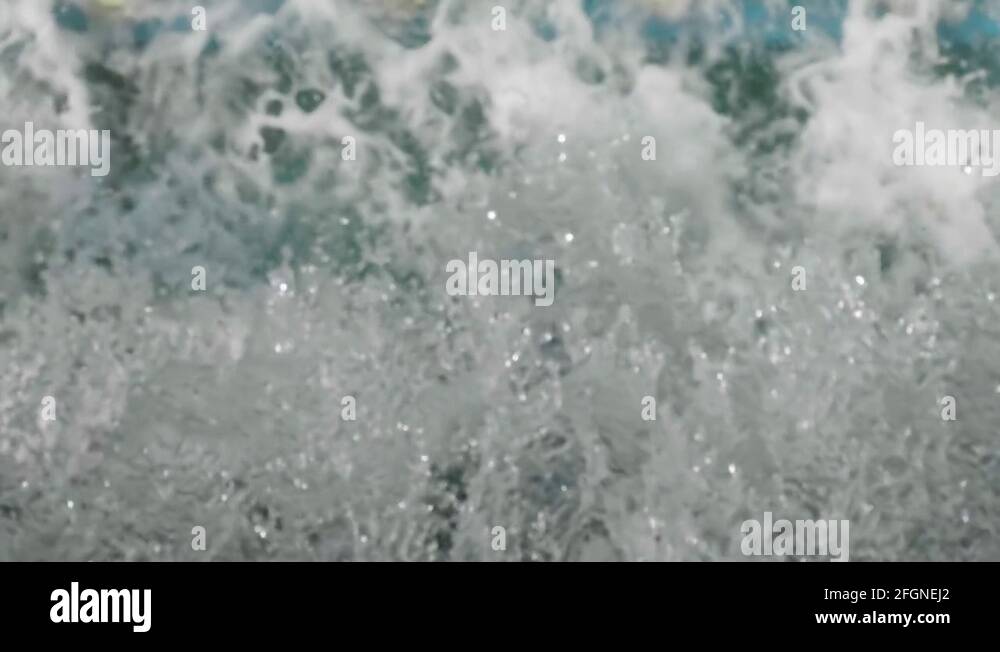 Water flow of fountain falling down into water making foam Stock Video ...