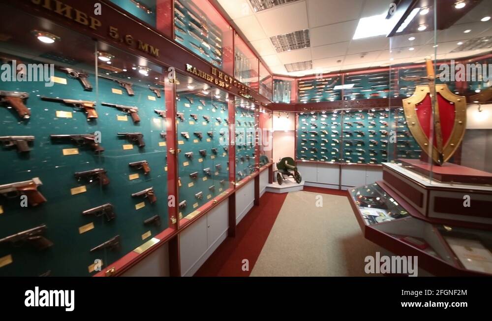 Gun museum of a many pistols, daggers and shield with tuck in center ...