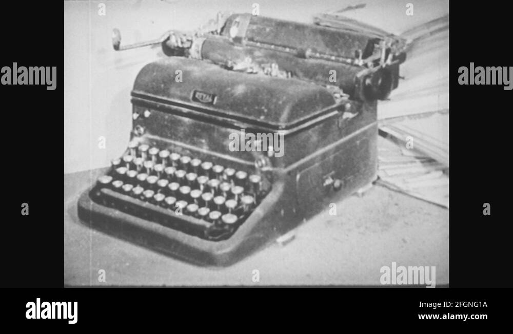 1940s: UNITED STATES: dusty typewriter. Lady types on typewriter. Lady ...