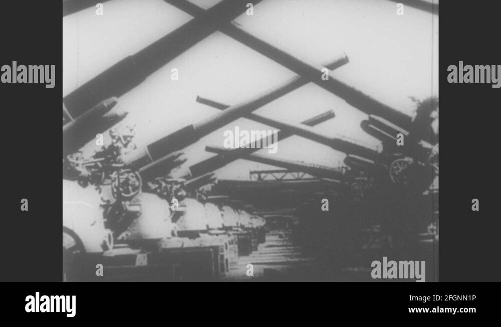 1950s: artillery cannons aim to sky and fire shells. land explodes in a ...