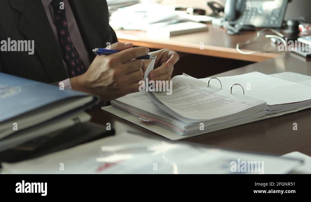 Reviewing documents Stock Videos & Footage - HD and 4K Video Clips - Alamy