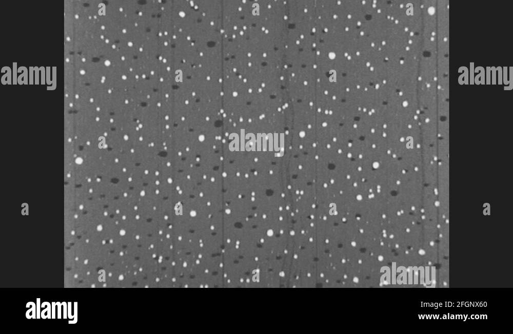 1950s: UNITED STATES: Animated dots falling. Lines on screen. Animation ...