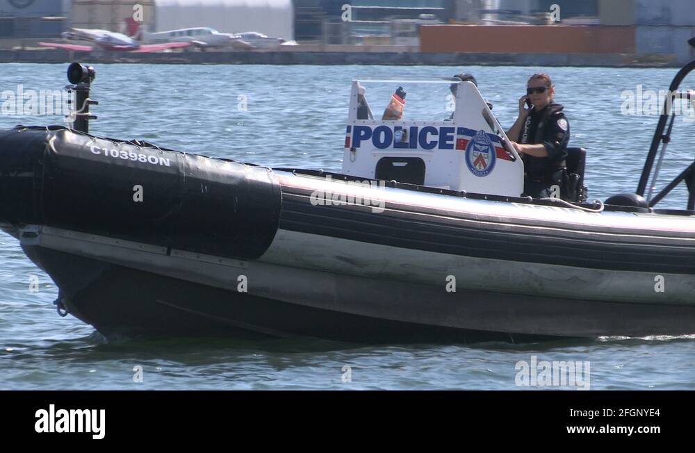 Police officers on marine unit patrol boat in Toronto harbor Stock ...