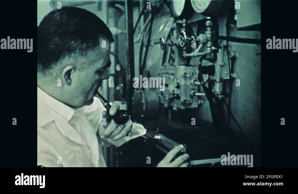 1970s: Man with equipment. Lab equipment. Man next to tank. Man looks ...