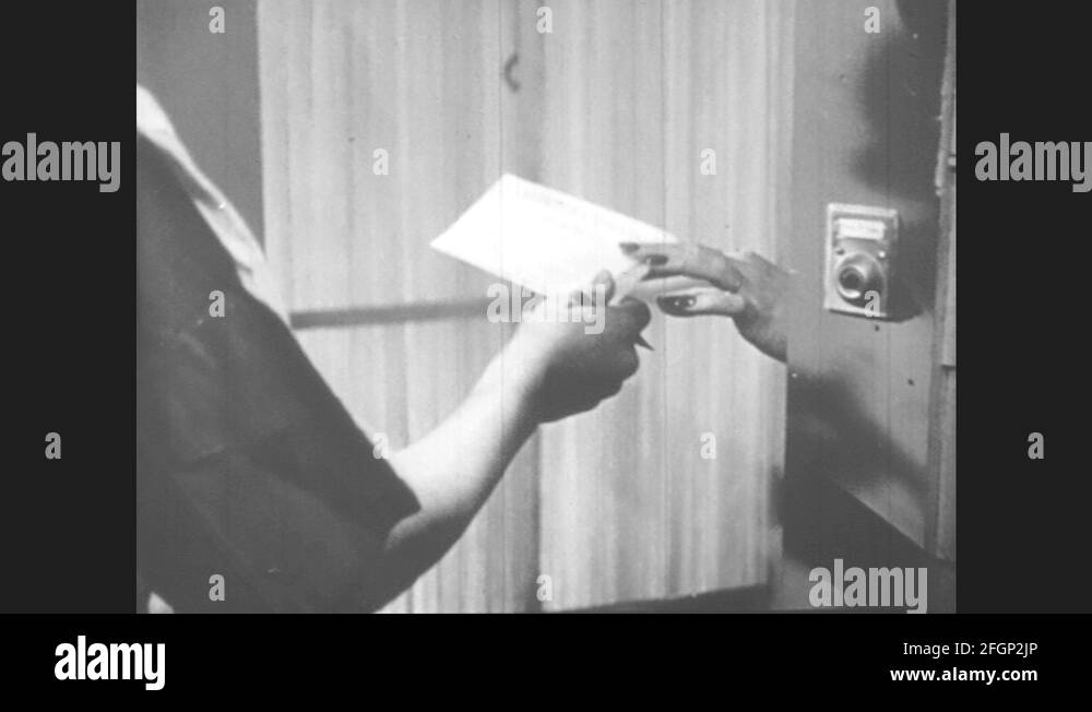 Europe 1940s: hand delivers telegram. Stars on sign. Photos of man in ...