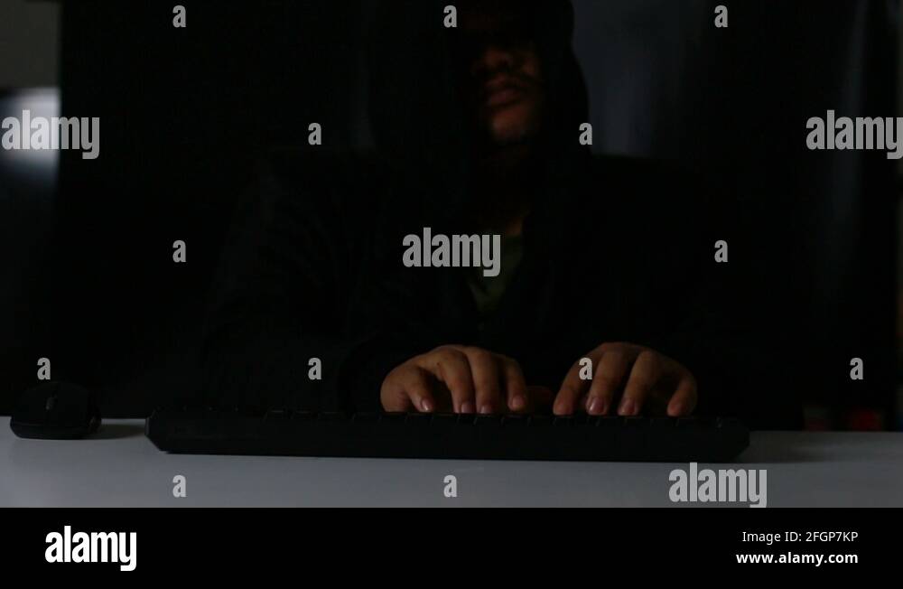 Hacker Typing Keyboard For Cyber Technology Criminal Concept With Dark