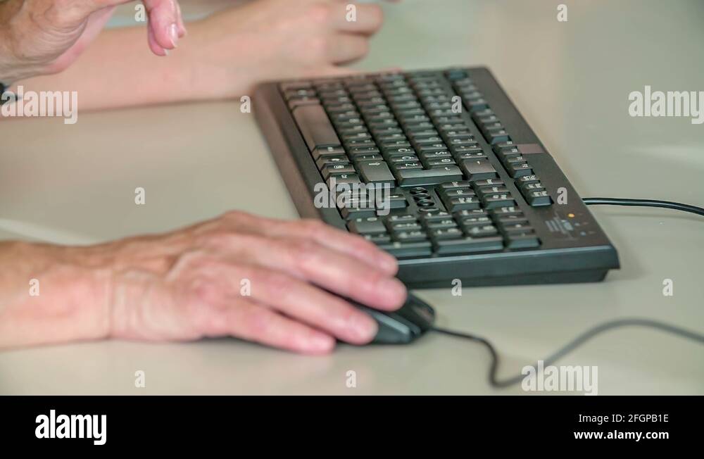 Slowly moving the mouse and learning basic computer skills Stock Video ...