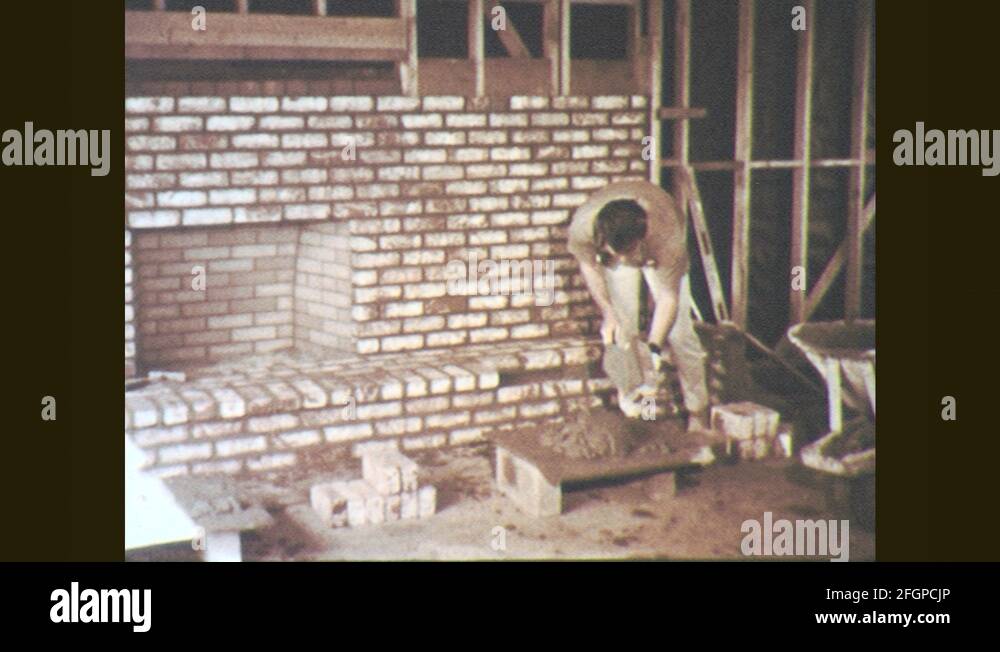 1950s: Man lays bricks. Man builds stairs. Man saws wood outside Stock ...