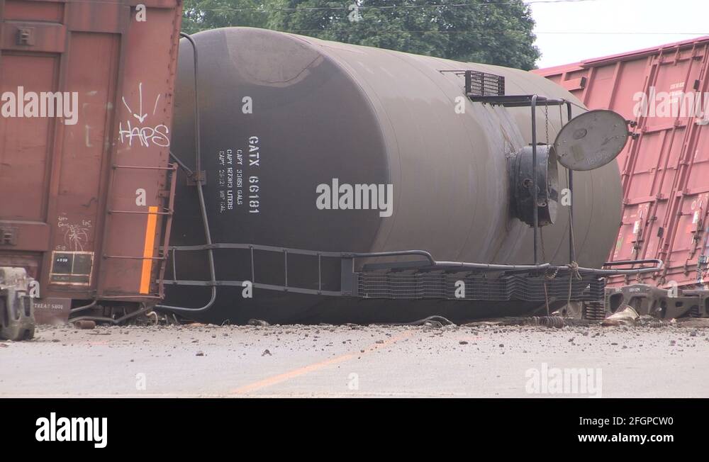 Freight and chemical tanker train derailment in middle of small town ...