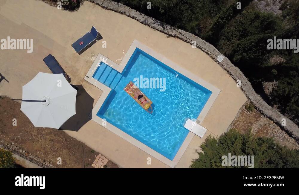Pool lilo woman Stock Videos & Footage - HD and 4K Video Clips - Alamy