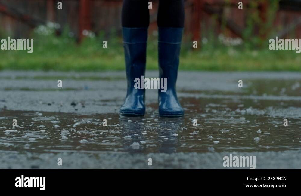 Puddles and boots Stock Videos & Footage - HD and 4K Video Clips - Alamy