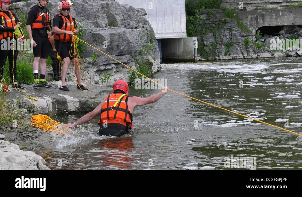 water rescue training reeling victim in with rope 4k Stock Video ...